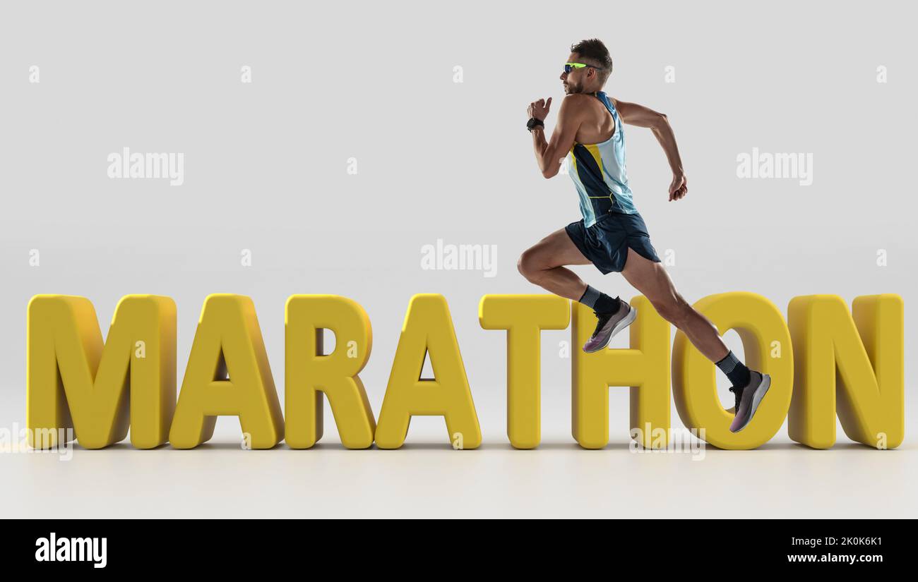 Triathlon male athlete running along 3d lettering Marathon over white ...