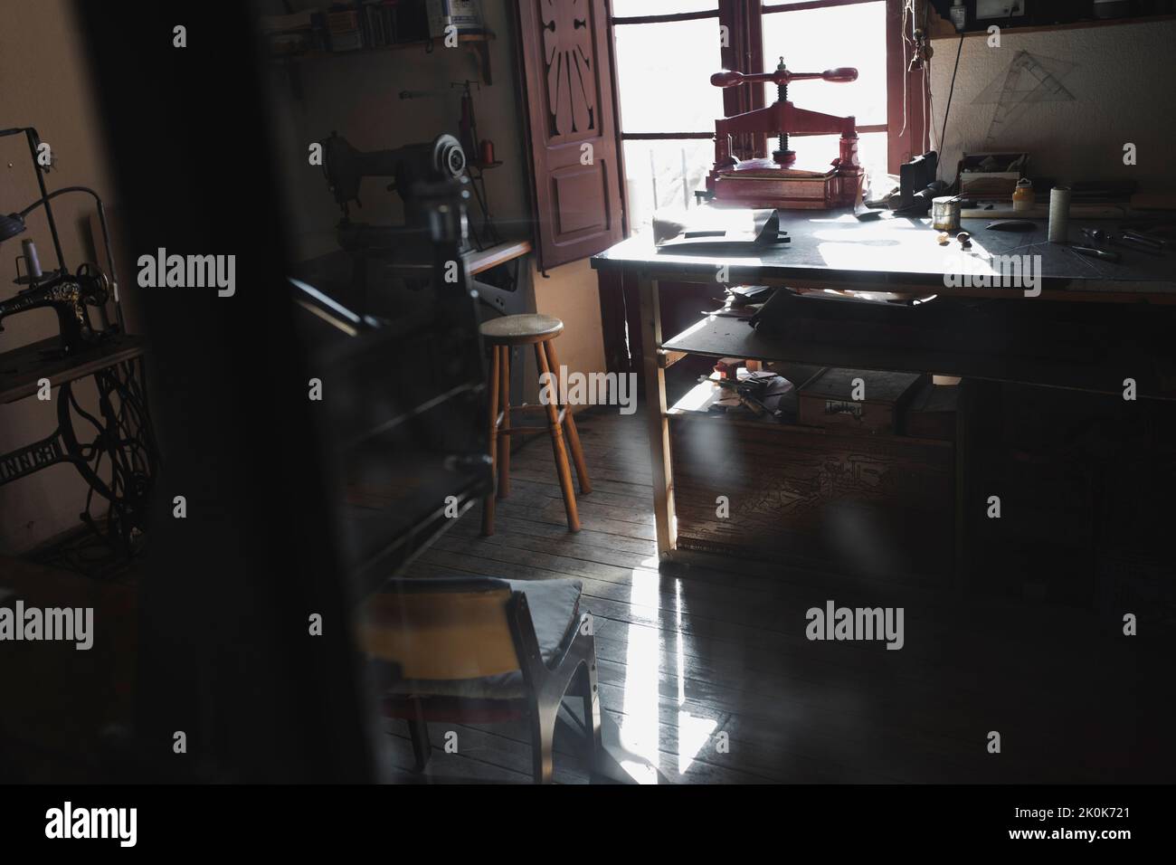 Workshop with various instruments and tools in dark atelier Stock Photo ...