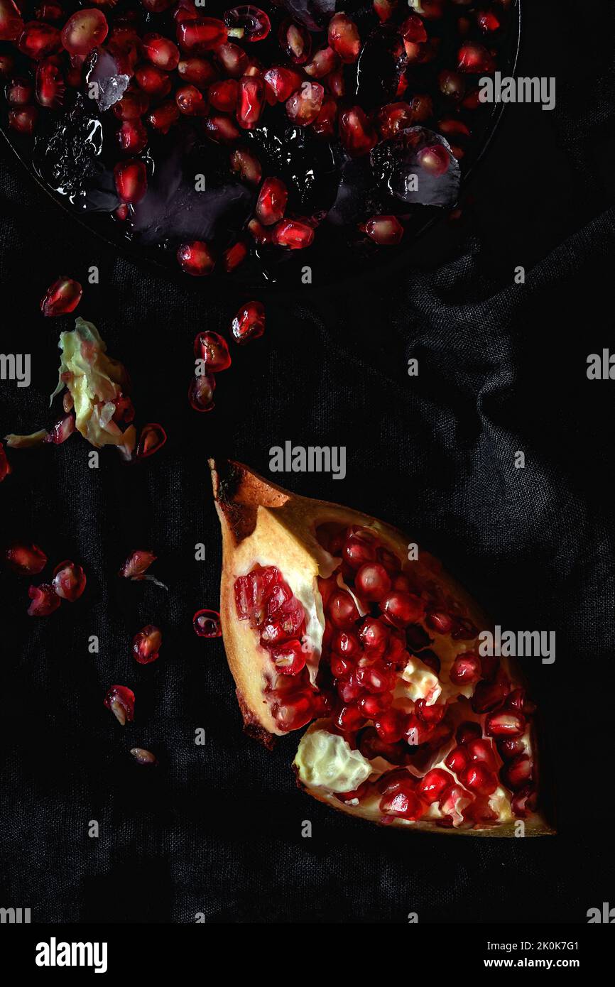 Fresh and red pomegranate on dark background. Fall season fruit. Top ...