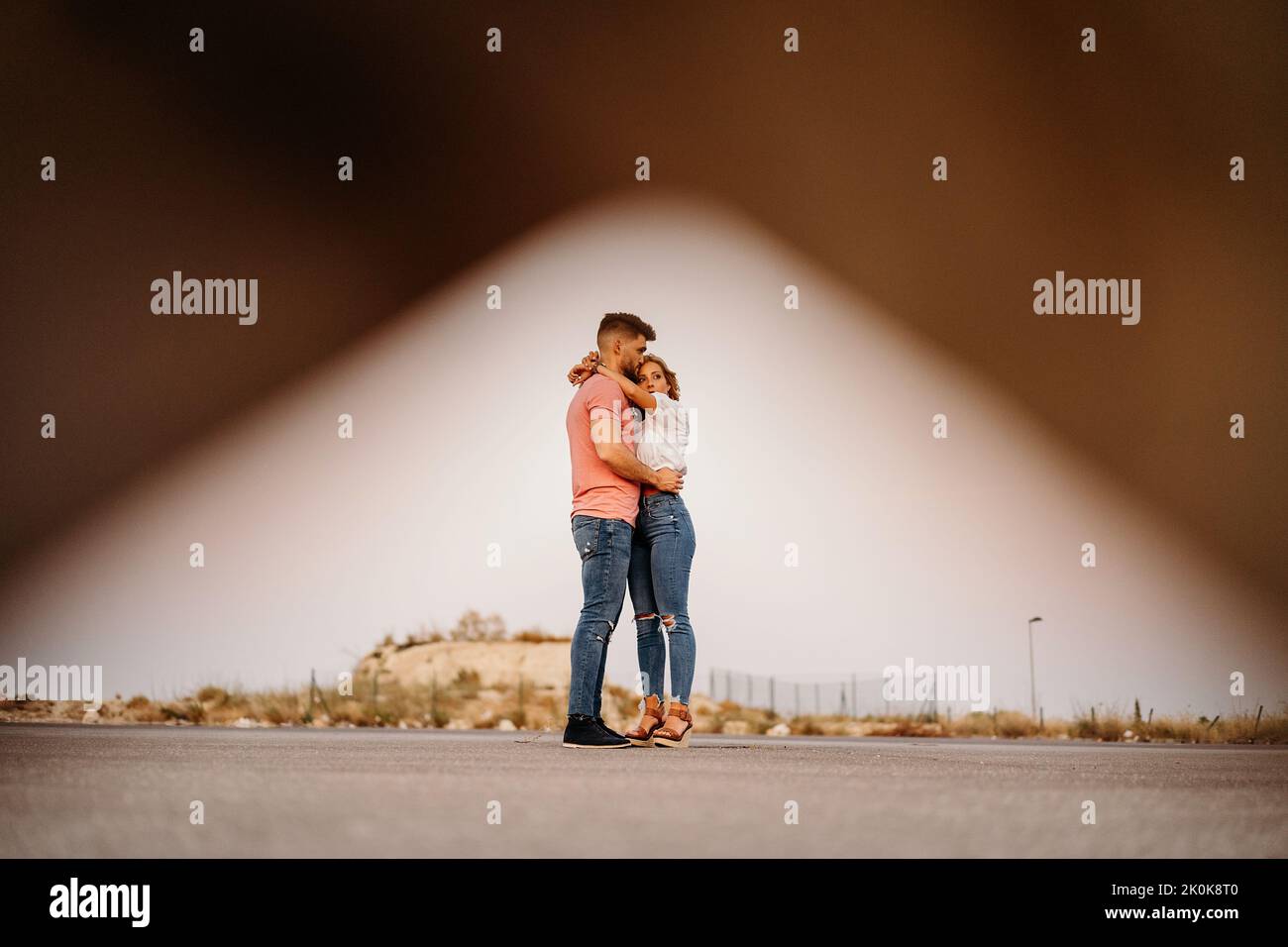 From below side view of calm man and pensive woman in casual clothes ...
