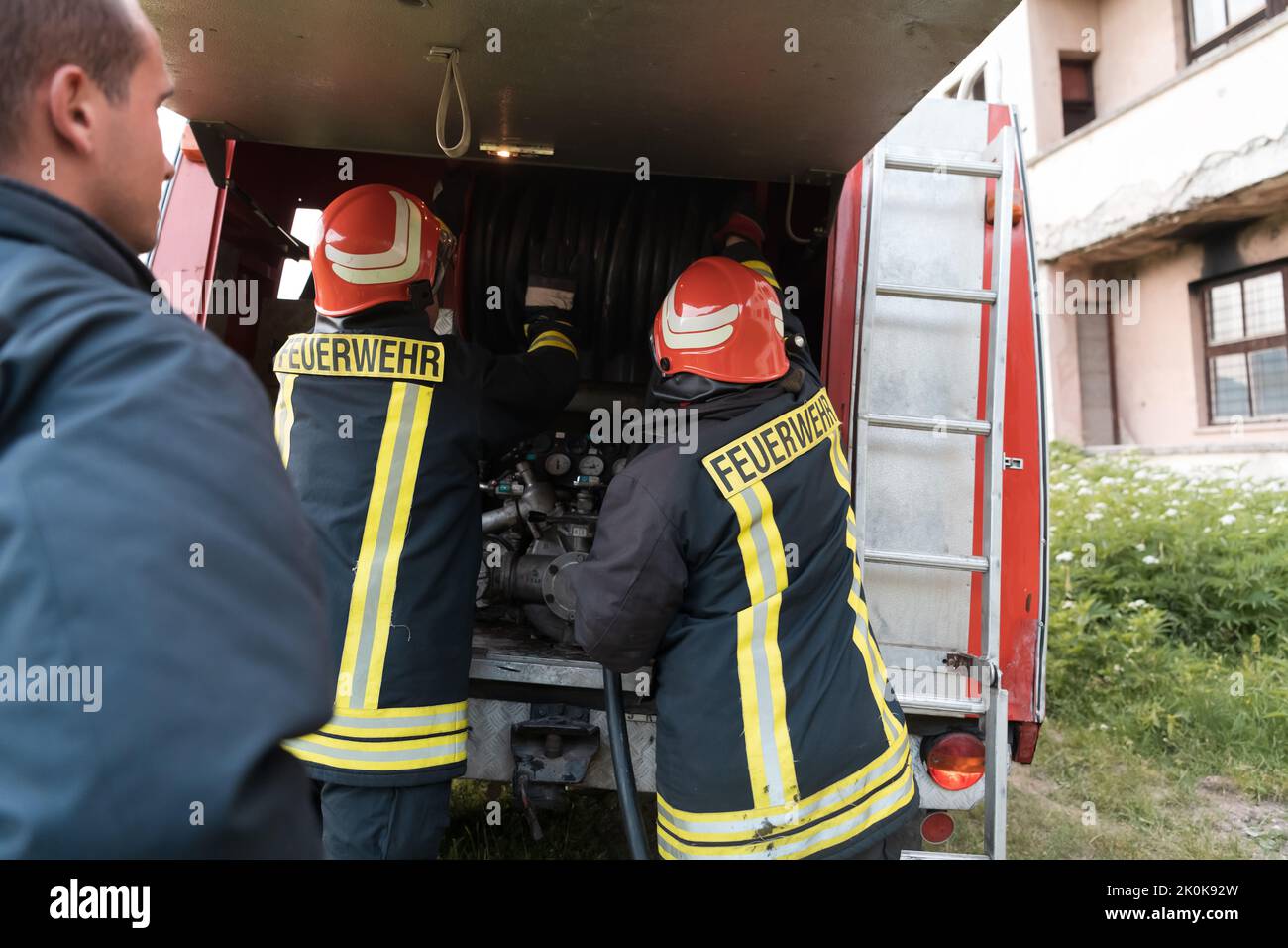 Group of fire fighters standing confident after a well done rescue ...