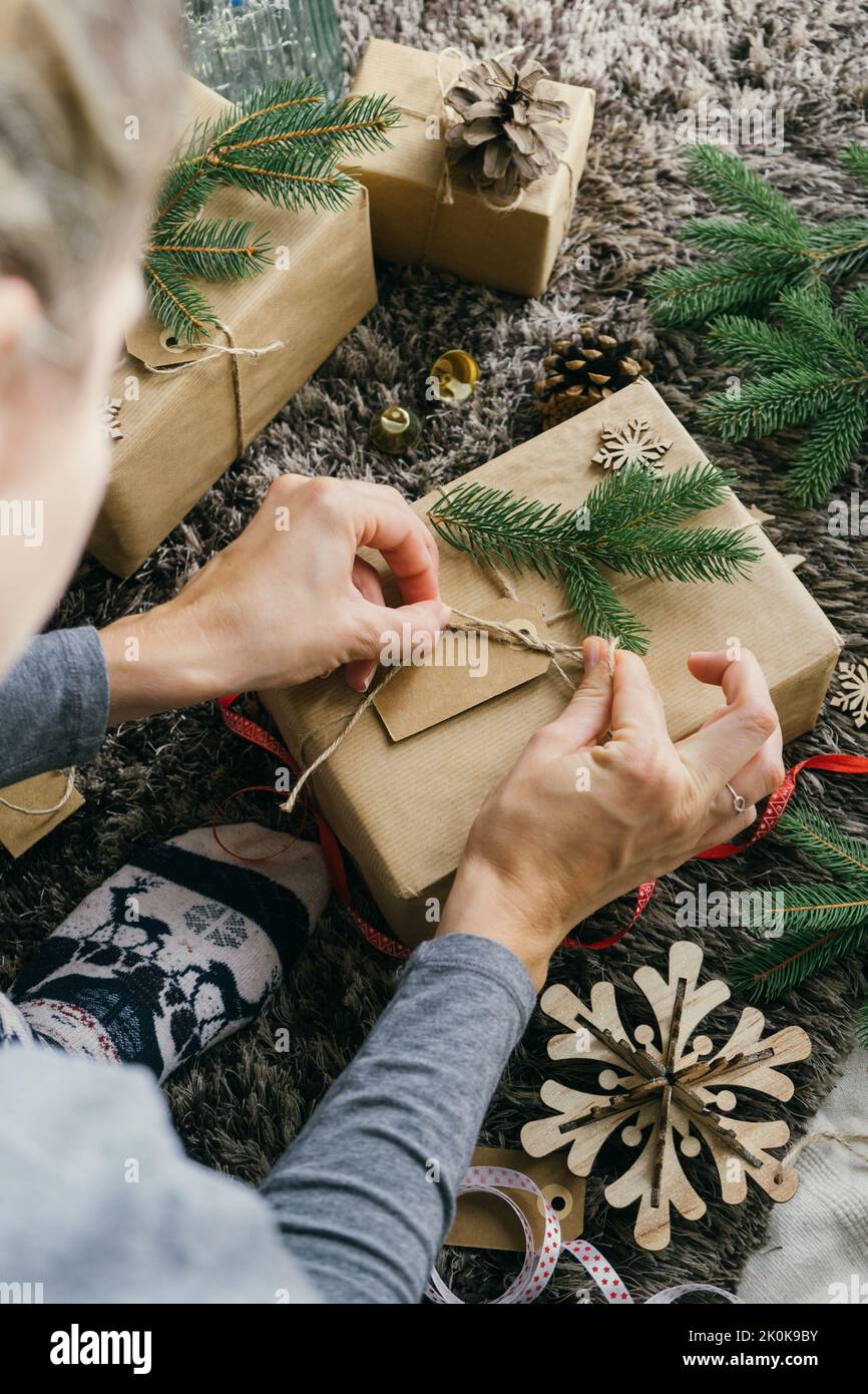 woman wrapping a christmas present Stock Photo - Alamy