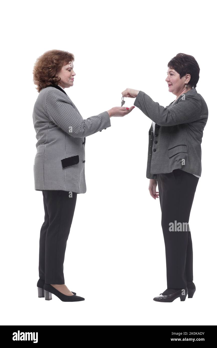 in full growth. real estate agent handing keys to his client Stock ...