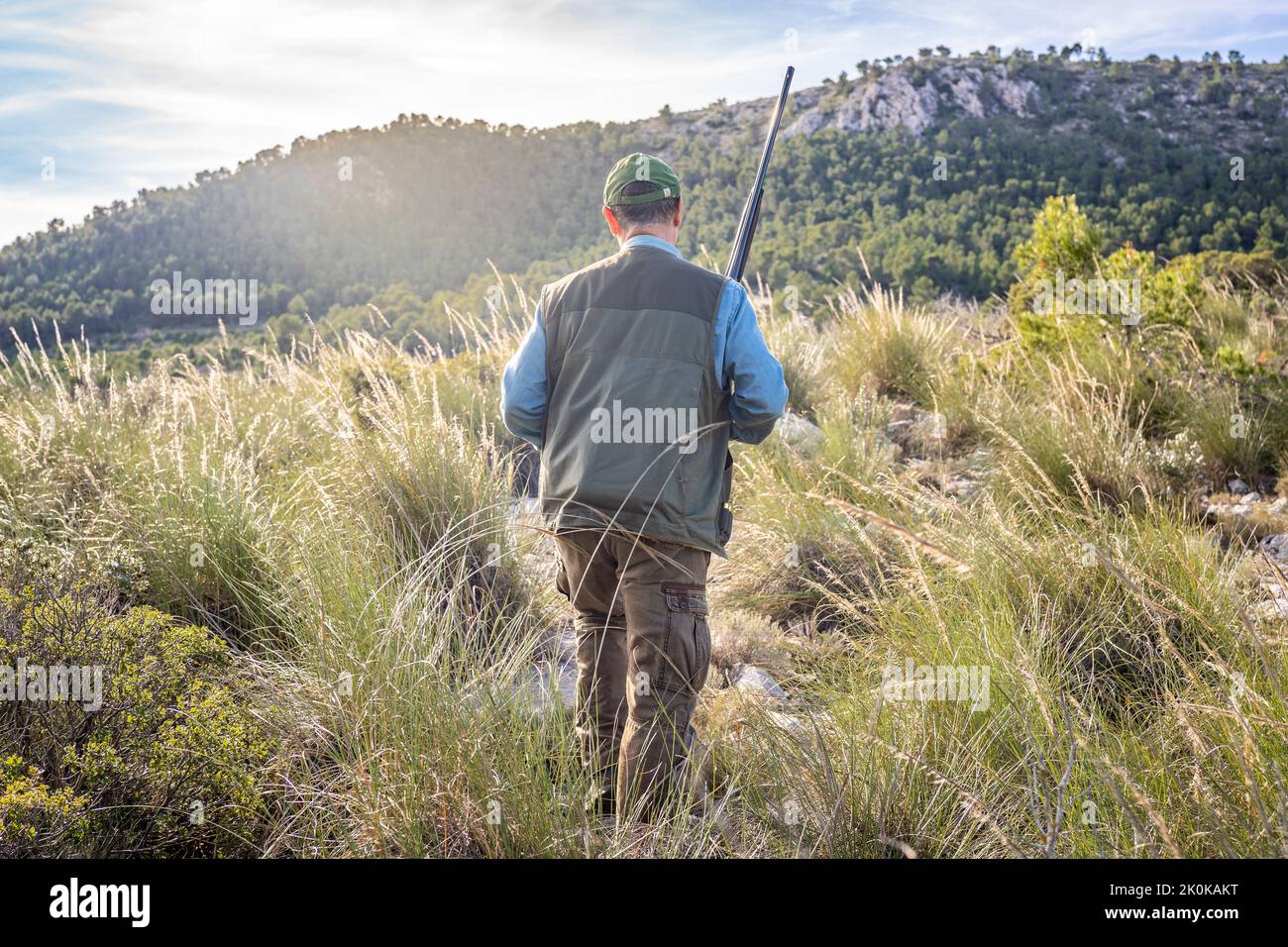 Hunter holding rifle looking away hi-res stock photography and images ...