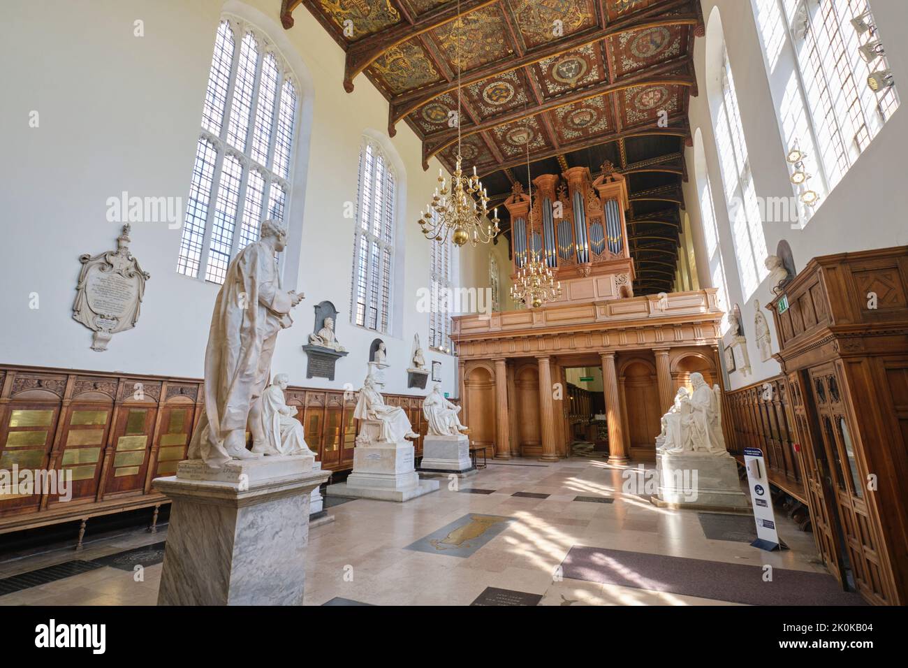 Interior view of the Trinity college chapel with marble statues of ...