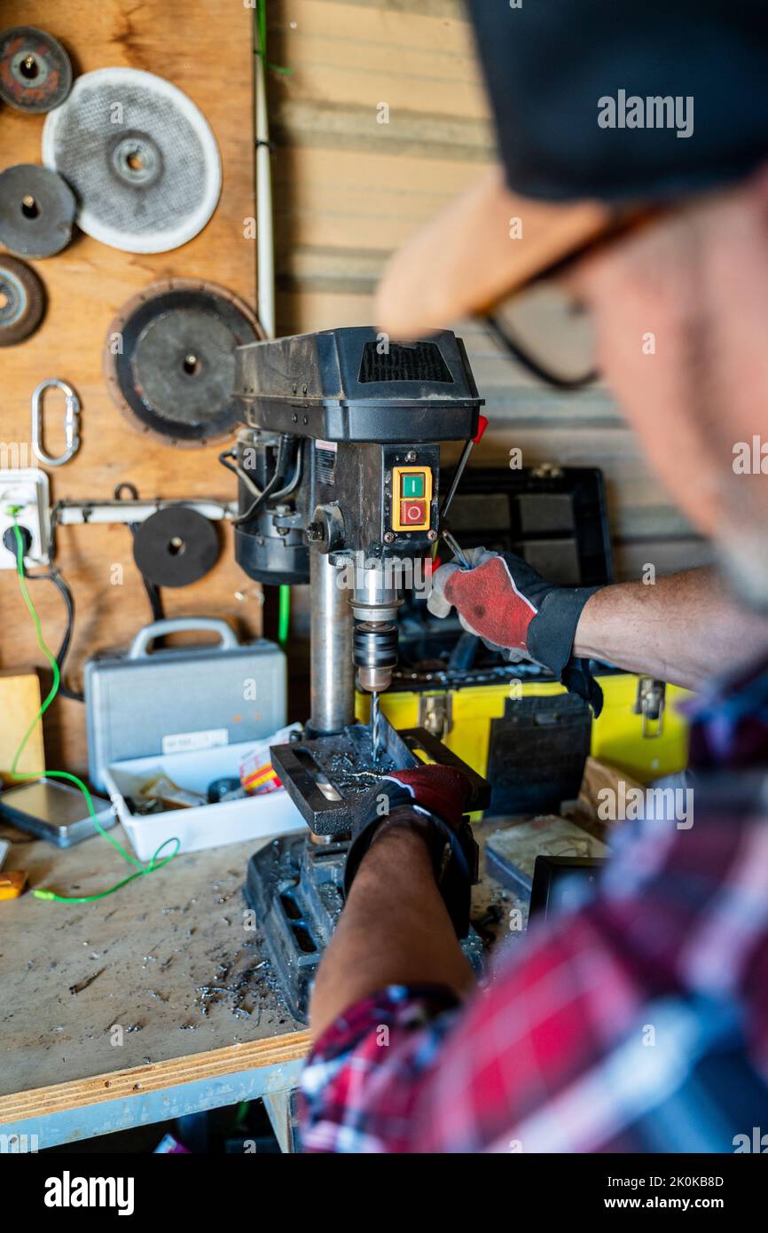 Back view man drilling hi-res stock photography and images - Alamy