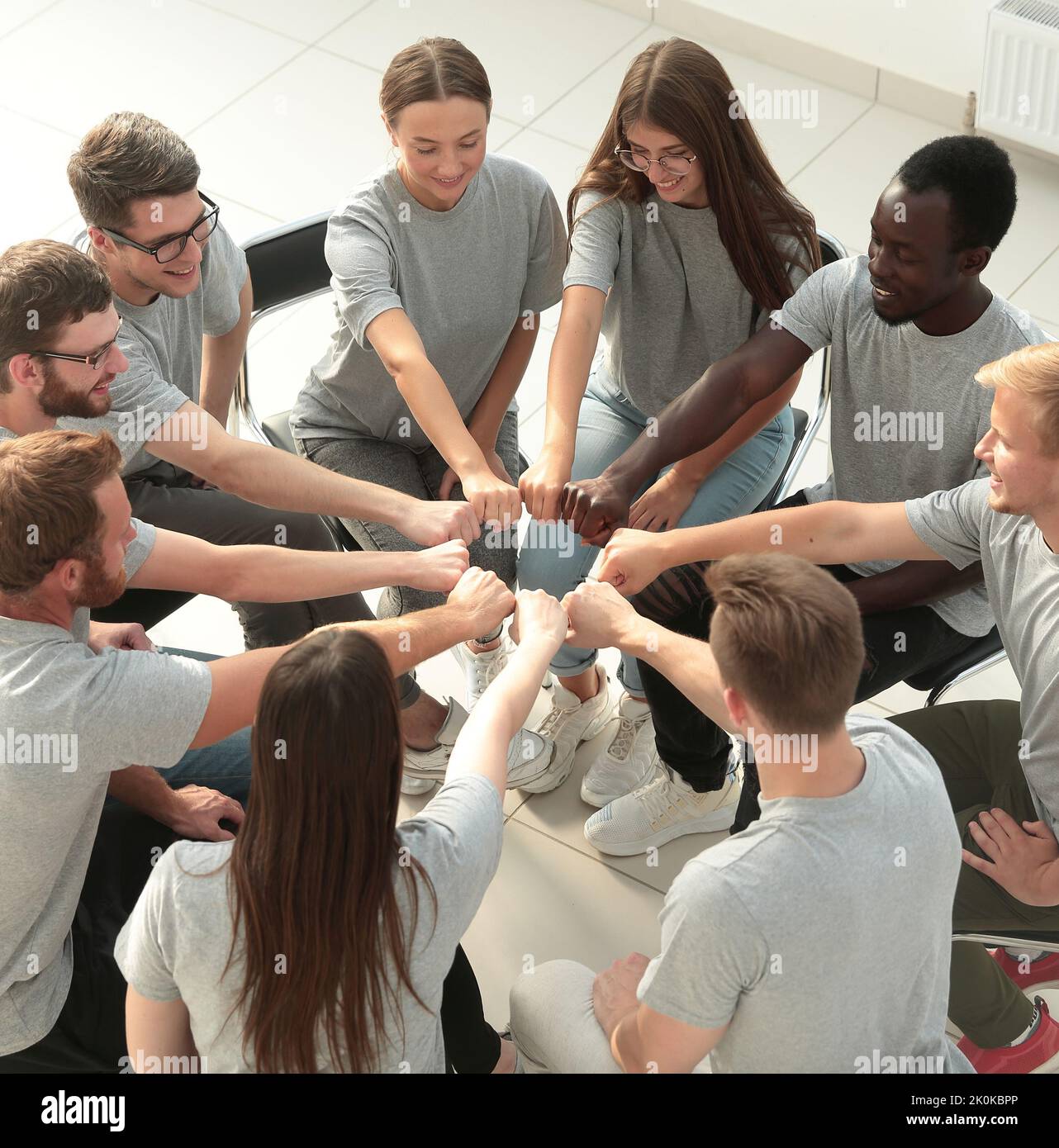 group of young like-minded people making a circle out of their h Stock ...