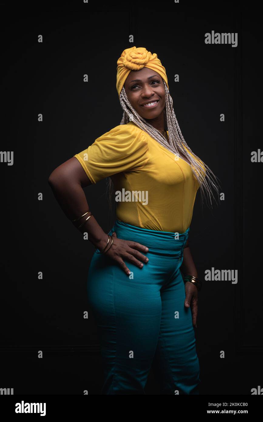 Side view of smiling young African American female with dyed Afro ...