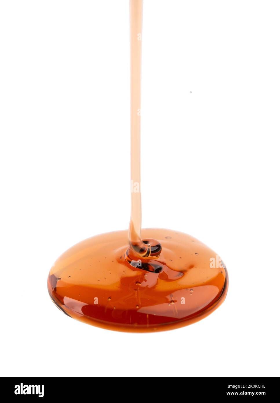 Caramel syrup drizzle isolated on white background. Splashes of sweet ...
