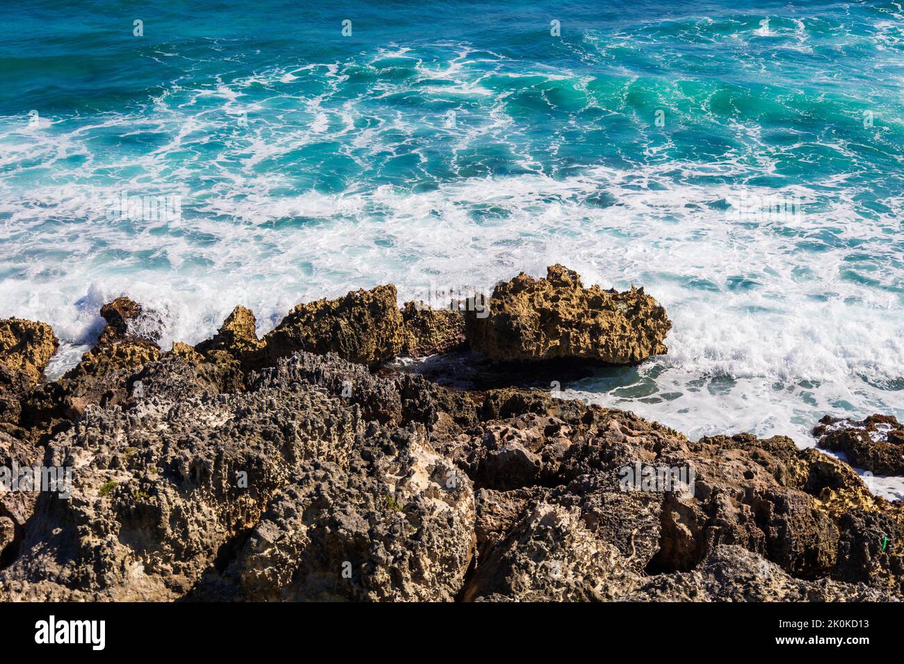 Oceans and rocks splitting the image Stock Photo - Alamy