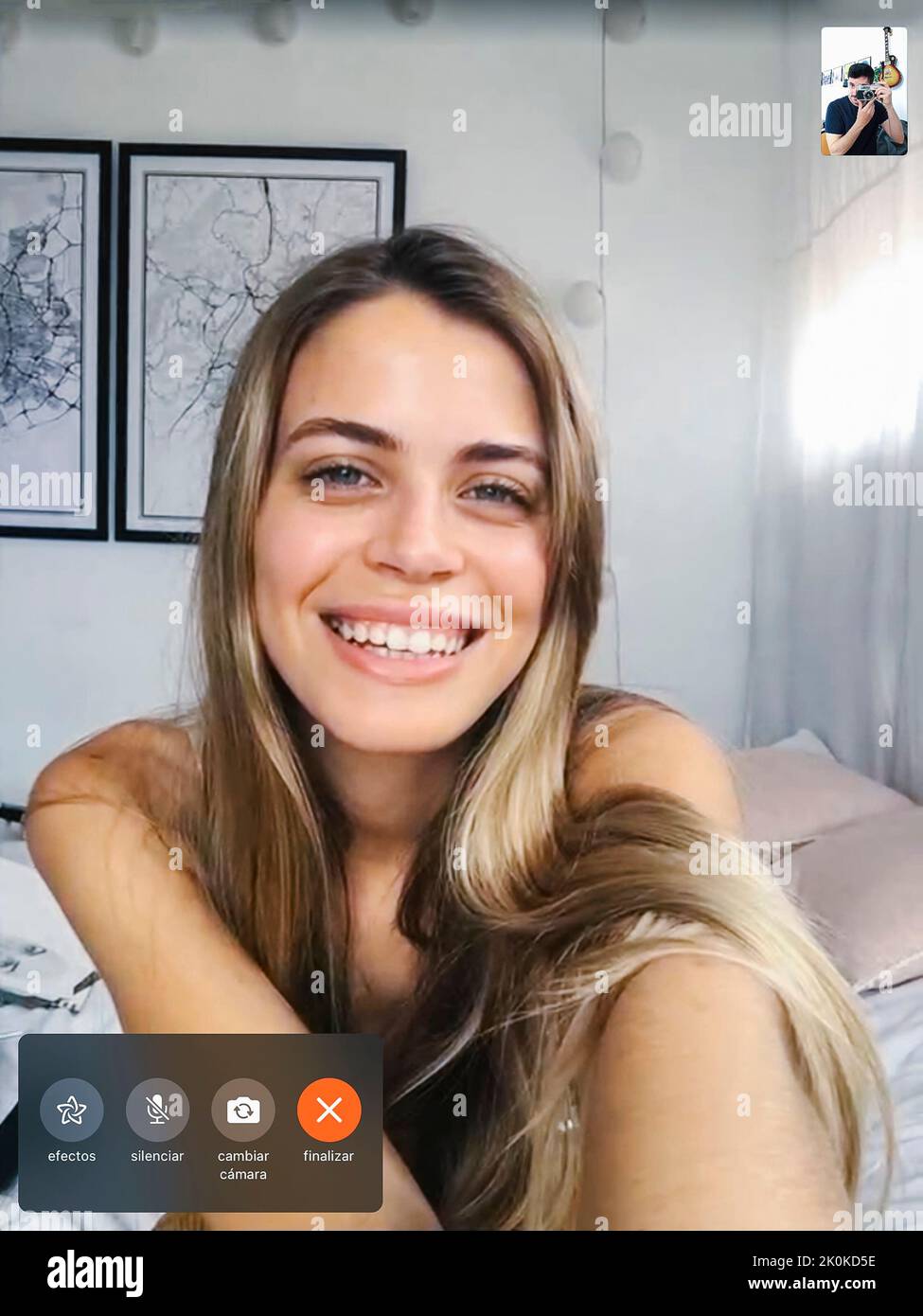 Happy smiley girl screen shot during a video call with a friend. The ...