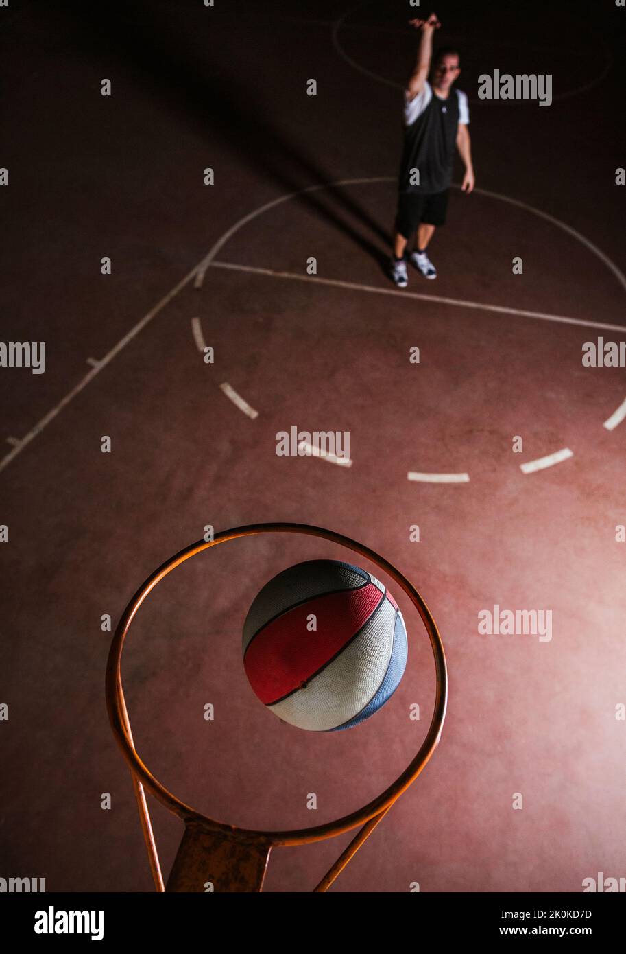 From above determined basketball player in sportswear performing ...