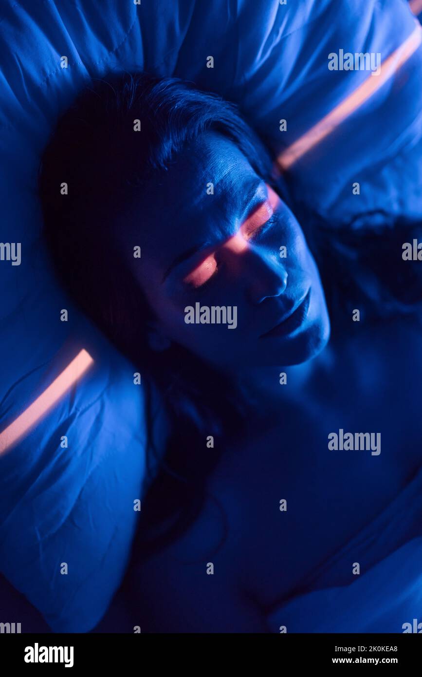 Close-up of lonely woman suffering from insomnia and depression, lying ...