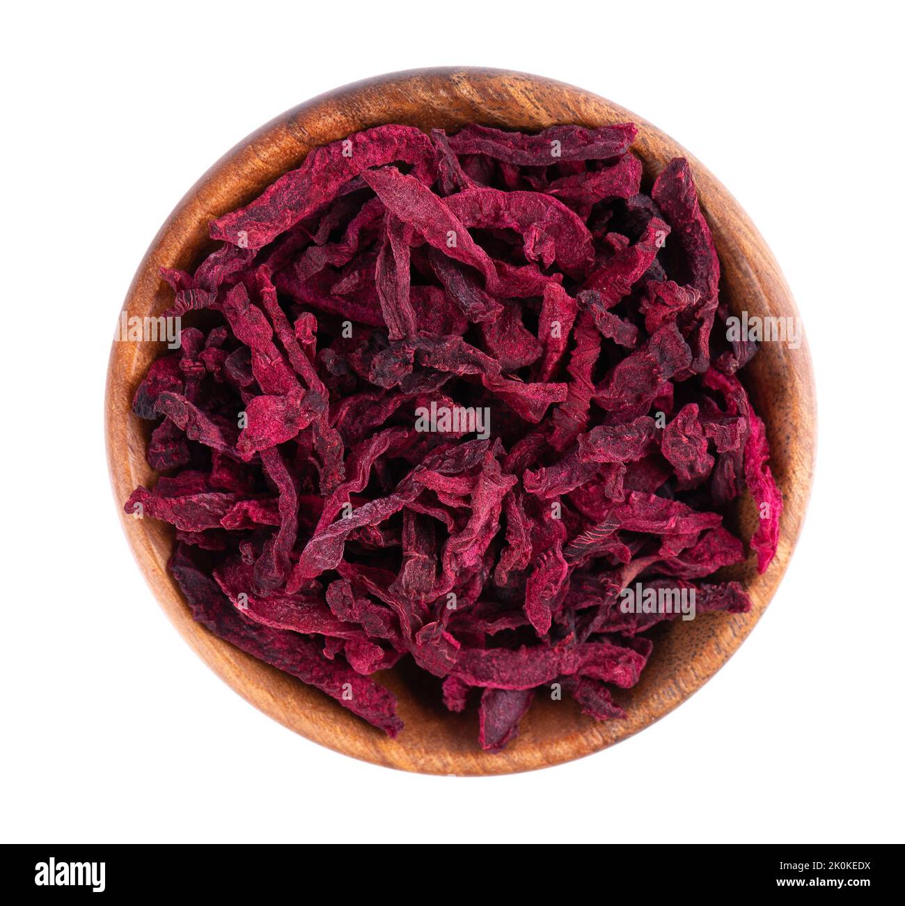 Dry beetroot in wooden bowl, isolated on the white background. Chopped ...