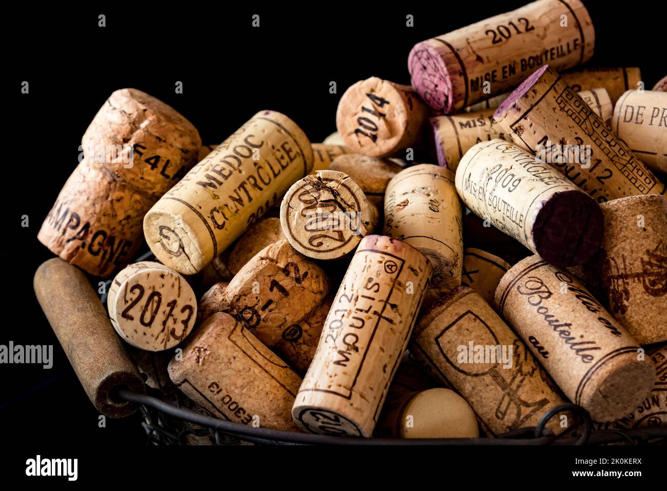 old cork stoppers of French wines in a wire basket Stock Photo - Alamy