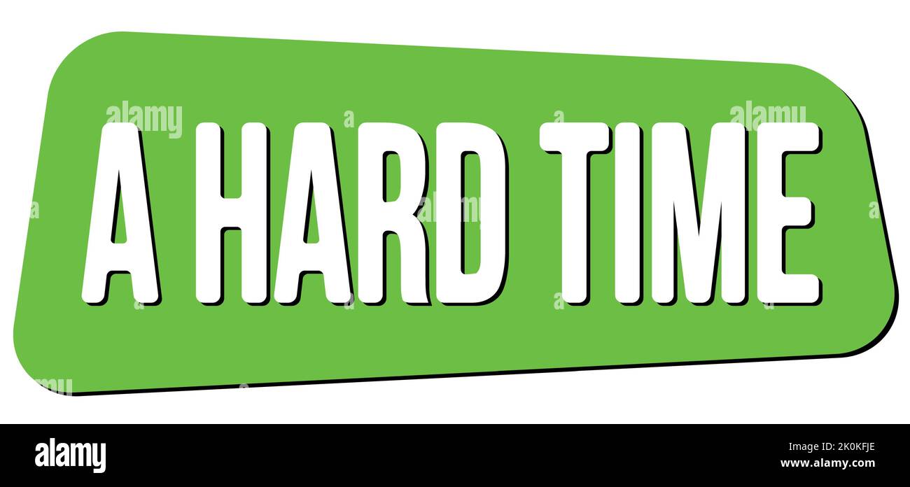 A HARD TIME text written on green trapeze stamp sign Stock Photo - Alamy