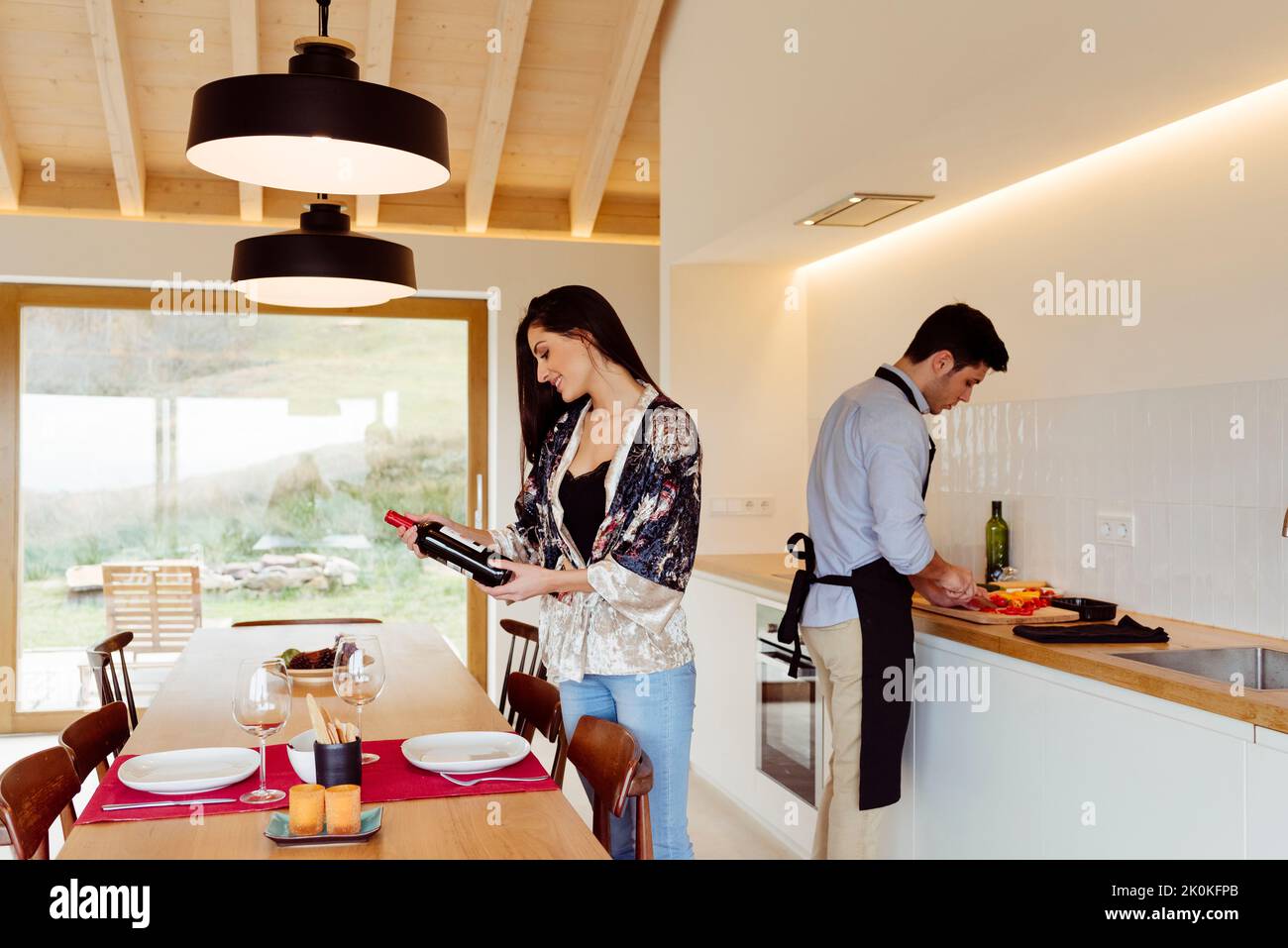 Side view of attractive couple cooking in a modern kitchen Stock Photo ...