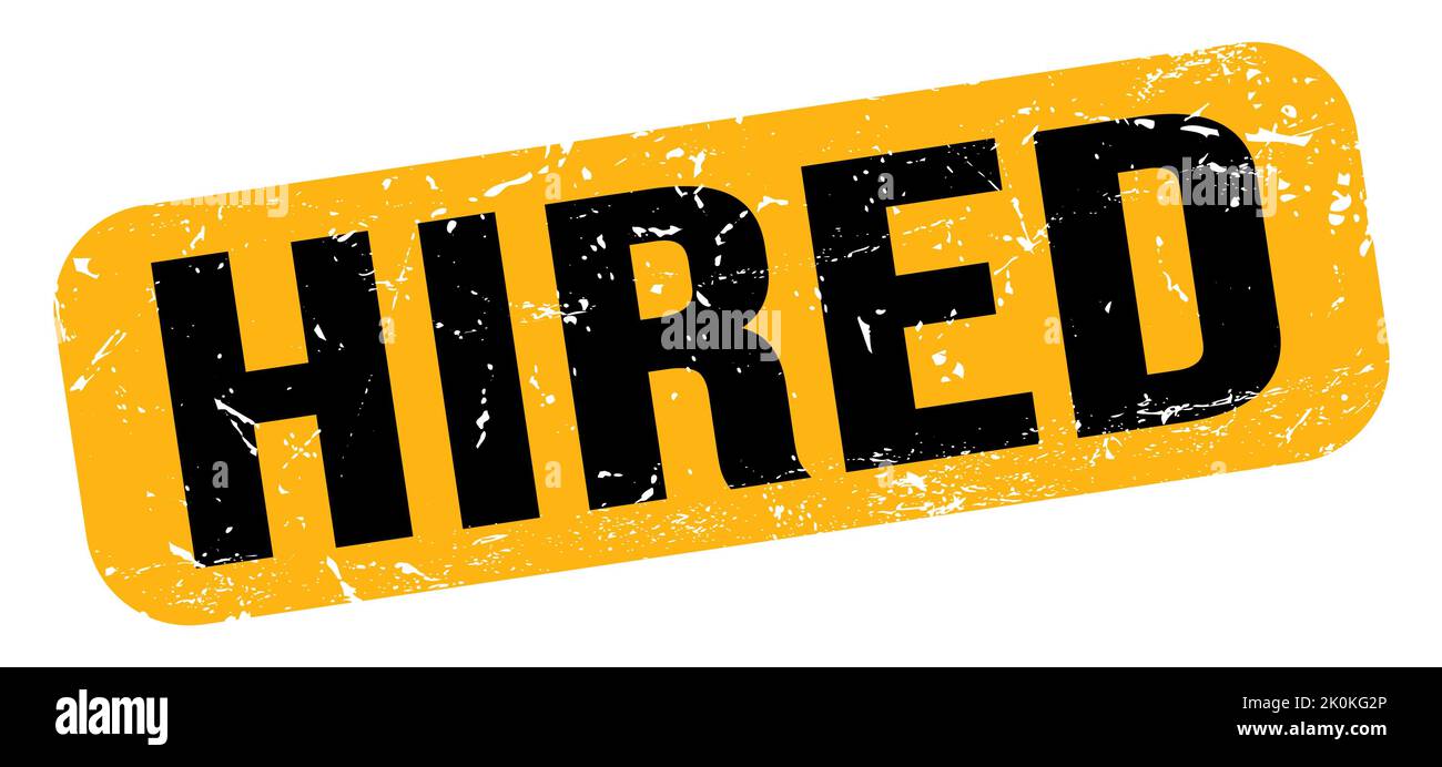 HIRED text written on yellow-black grungy stamp sign Stock Photo - Alamy