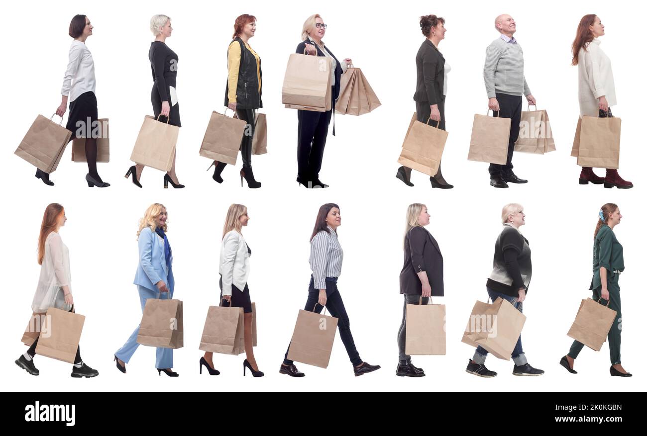 a group of people are running paper shopping bags Stock Photo - Alamy