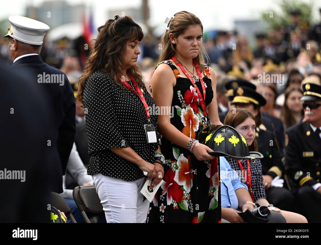 Jordyn Lesser, 13, holds the helmet of her father Platoon Chief Warren ...