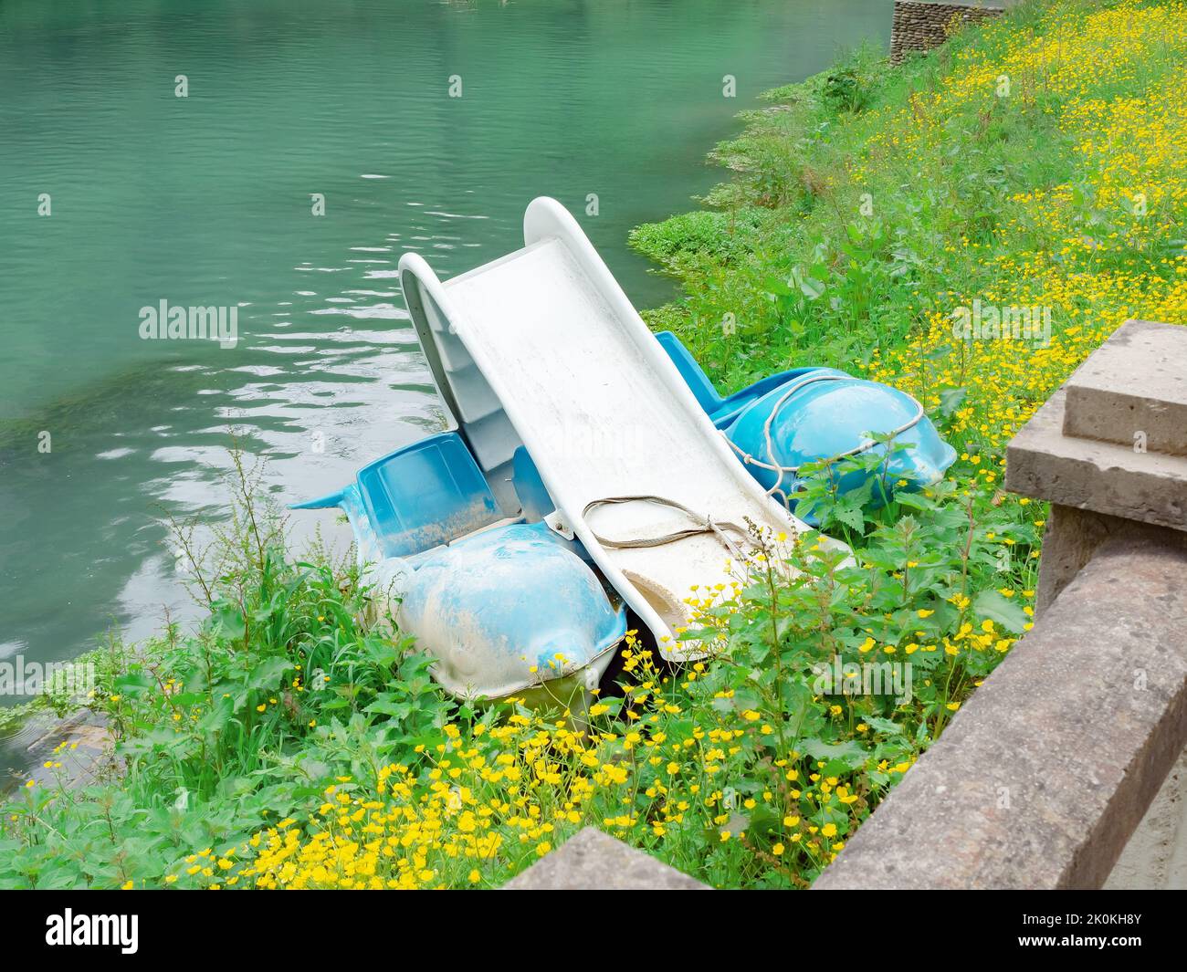 Water slide catamaran. Catamaran on the bank of a river Stock Photo - Alamy