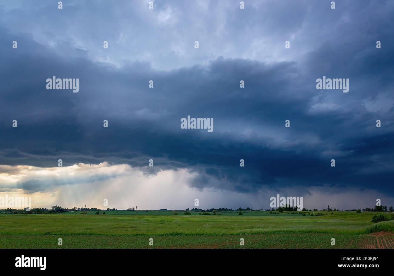 Storm clouds over field, tornadic supercell, extreme weather, dangerous ...