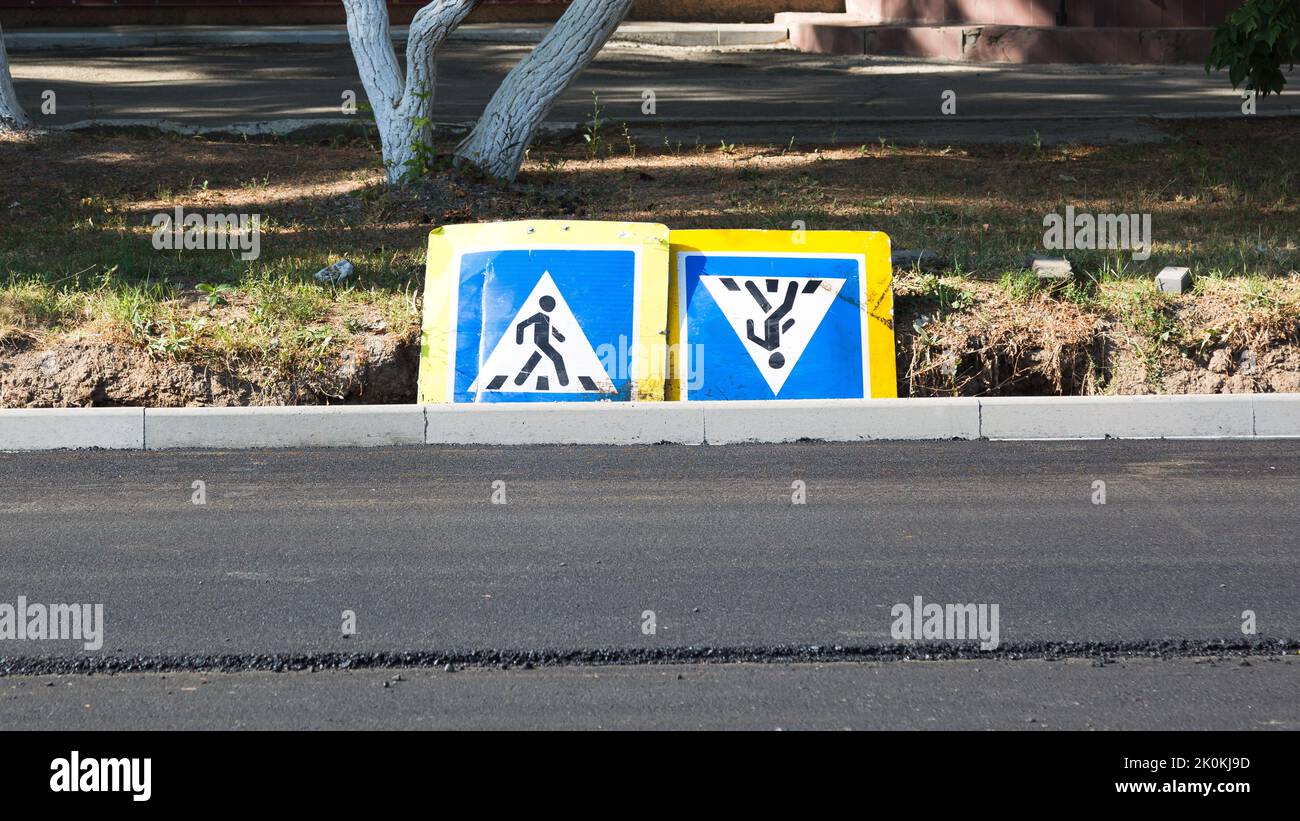 Road signs Pedestrian crossing lie on the ground for the duration of ...