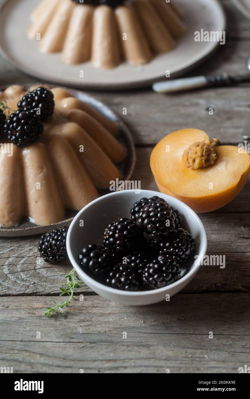 Closeup of served vegan panna cotta with peach and shiny sweet ...
