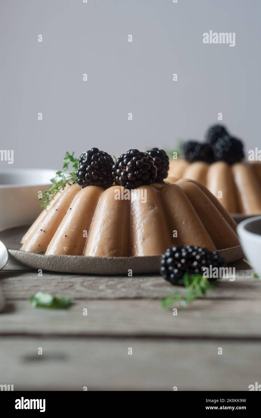 Closeup of served vegan panna cotta with peach and shiny sweet ...