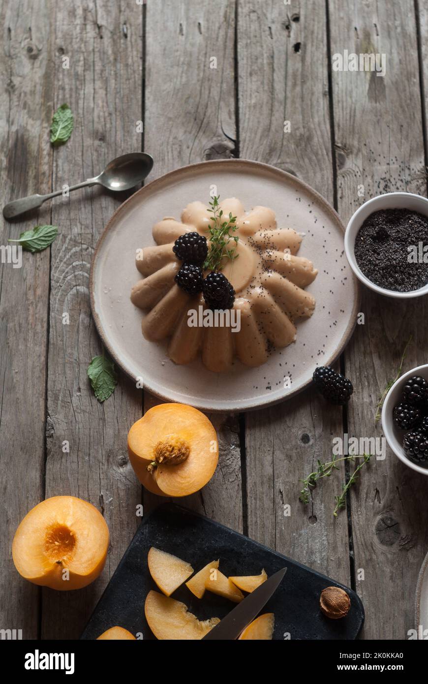 Closeup of served vegan panna cotta with peach and shiny sweet ...