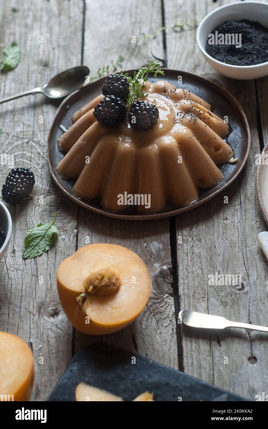 Closeup of served vegan panna cotta with peach and shiny sweet ...