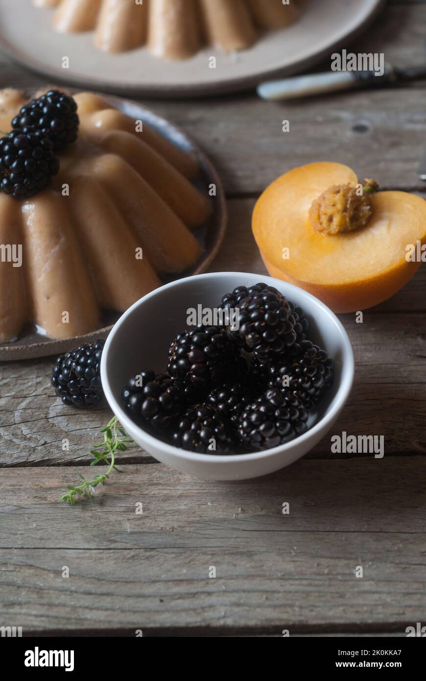 Closeup of served vegan panna cotta with peach and shiny sweet ...