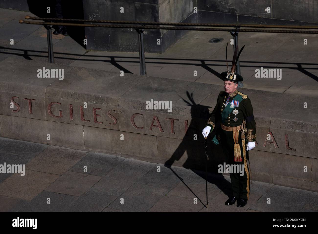 A royal archer stands outside St Giles' Cathedral, Edinburgh, ahead of ...