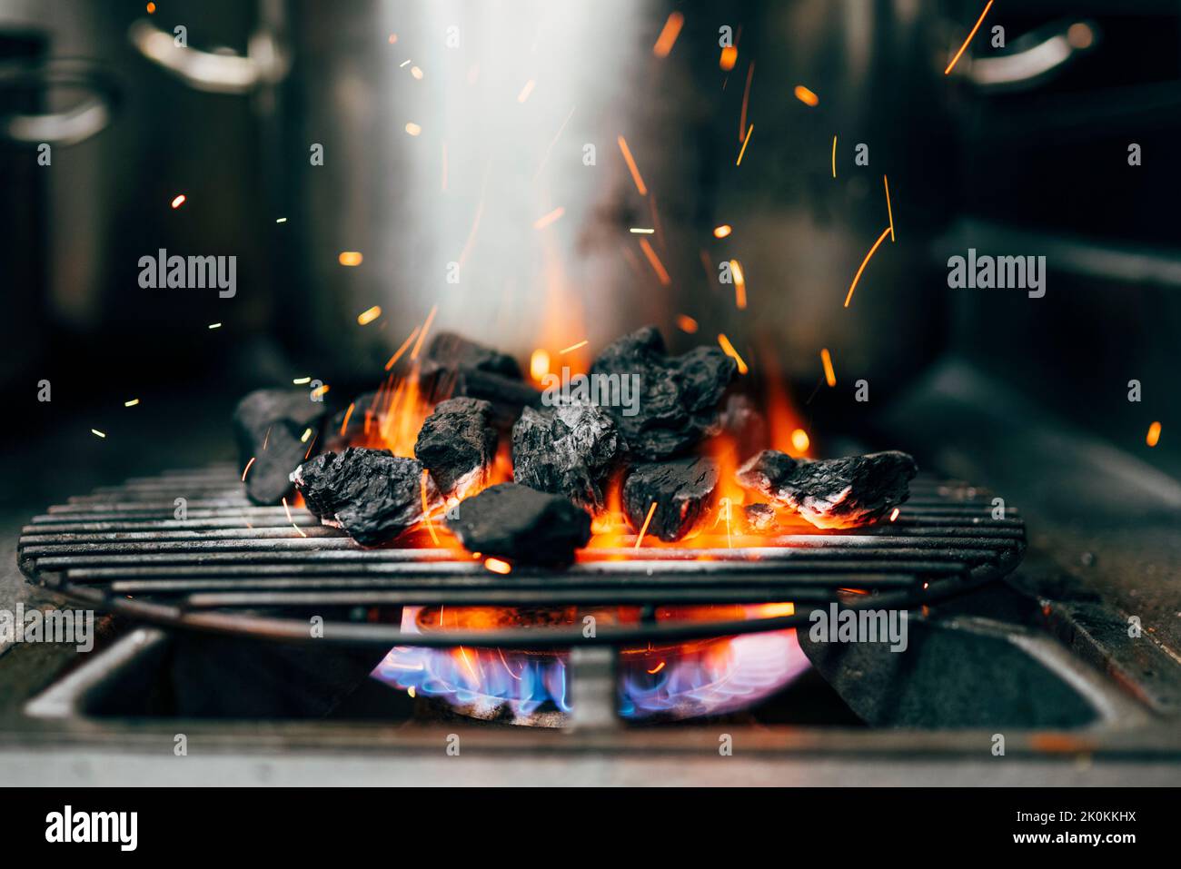 Closeup of blazing burning coal in flame and sparkles on grill Stock ...