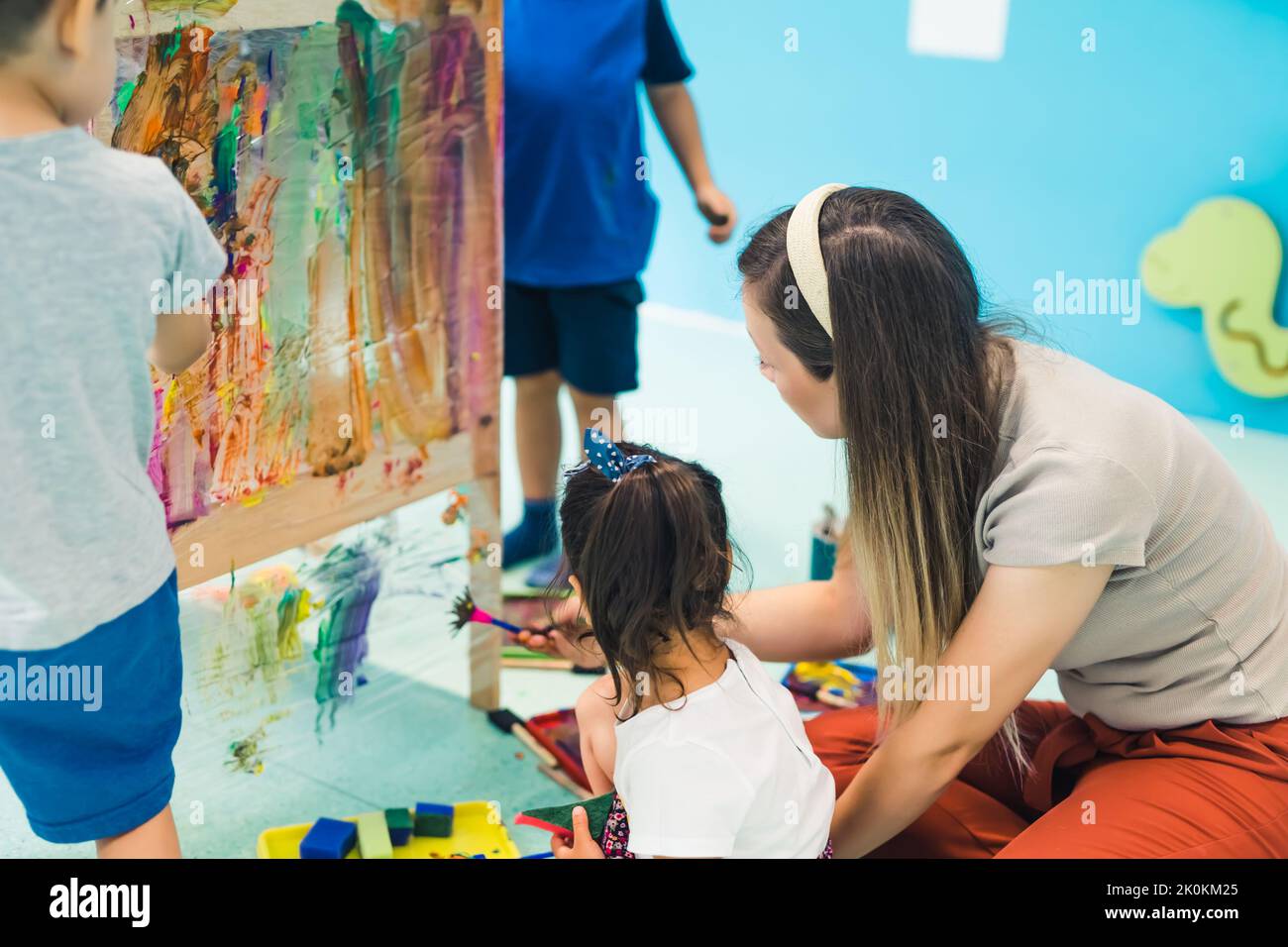 Helping painting hi-res stock photography and images - Alamy