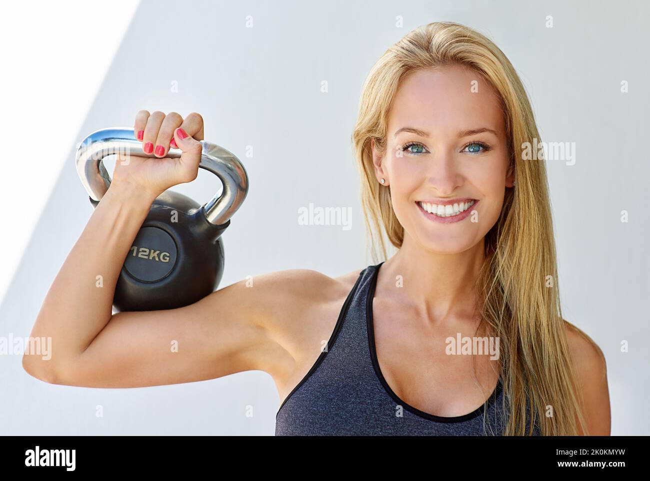 The perfect body takes work. Cropped portrait of a young woman holding ...