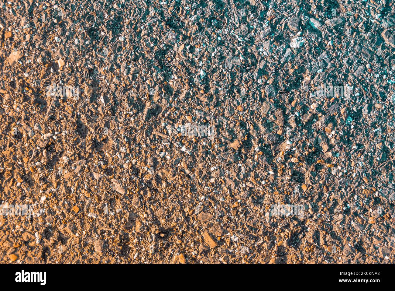 old asphalt texture with brown tint gradient overlaid, selective focus ...