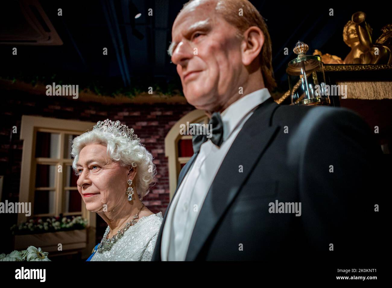 Wax figures honoring Queen Elizabeth II are on display at the i-City ...
