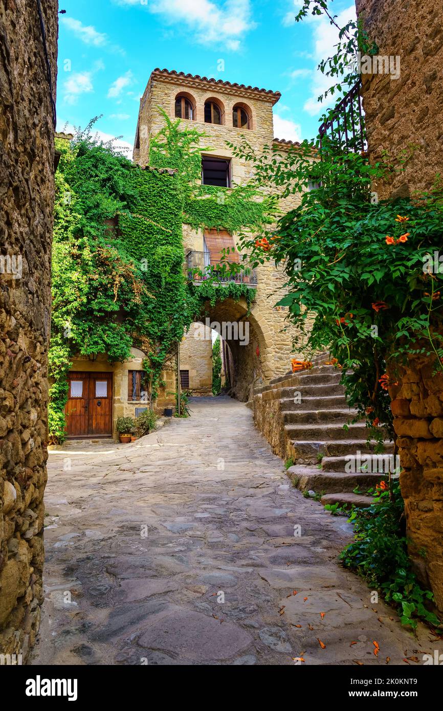 Beautiful and picturesque square with stone arches in the streets and ...