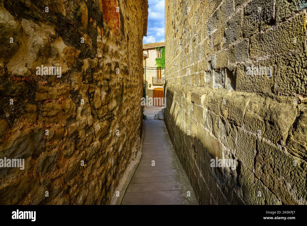 Very narrow alley between old stone houses for the passage of a single ...