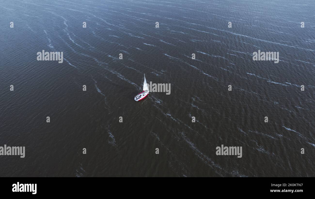 View from above, aerial view of sailing white modern not big sail boat ...