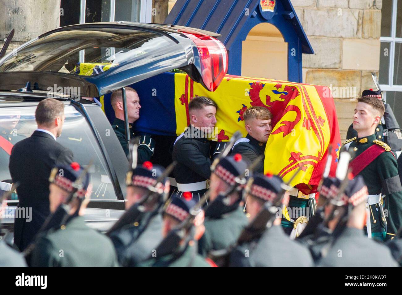 Royal guards carry Queen Elizabeth II's coffin at the start of the ...