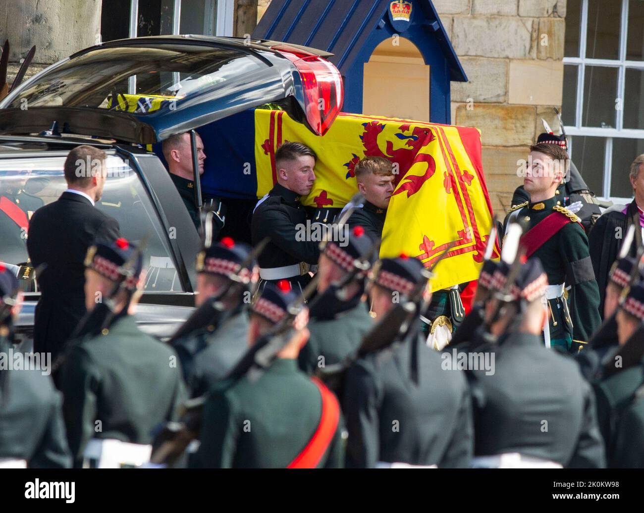 Royal guards carry Queen Elizabeth II's coffin at the start of the ...