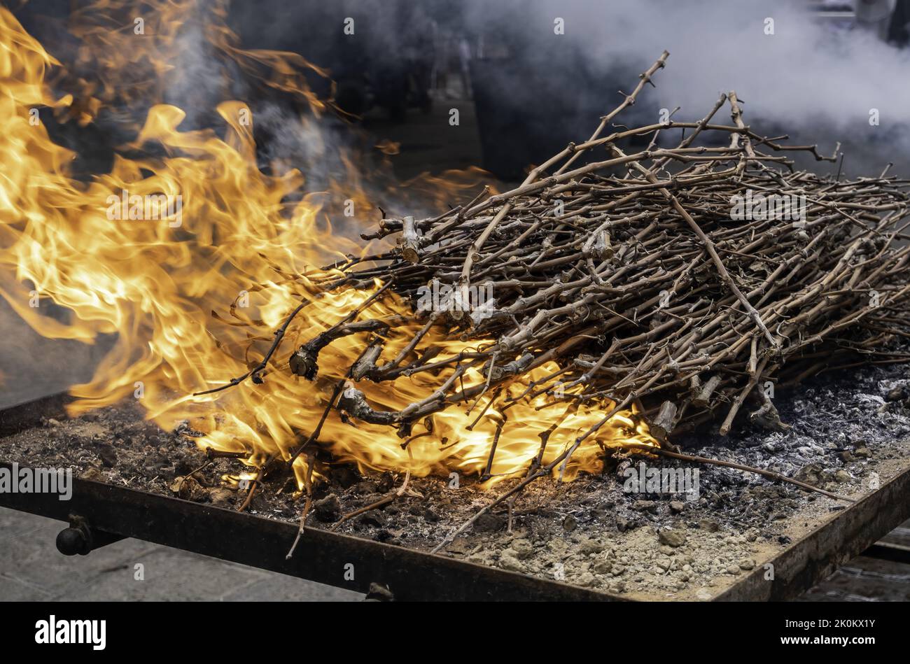 Detail of fire in some embers of vine shoot Stock Photo - Alamy