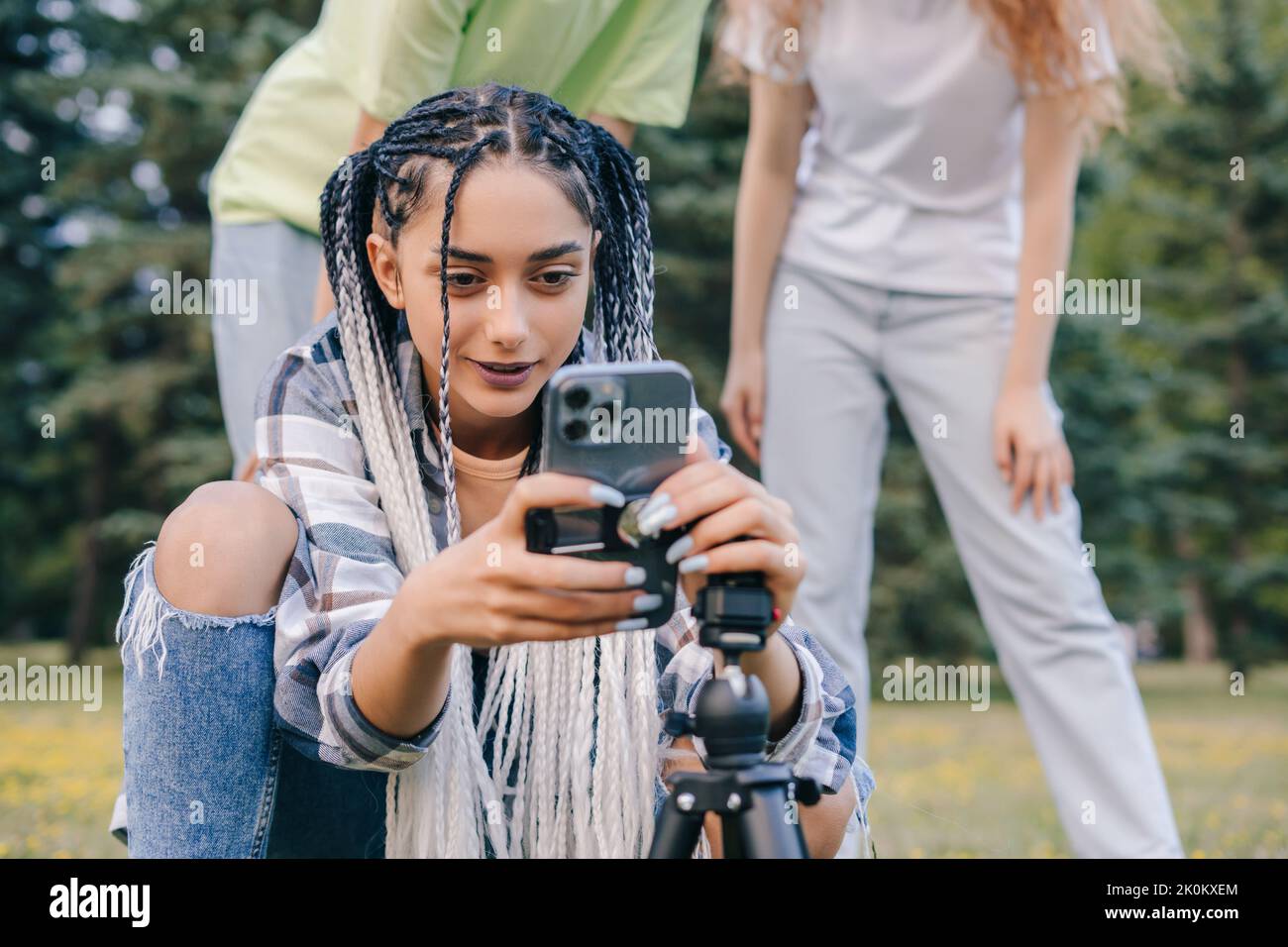 Boy filming friends hi-res stock photography and images - Alamy