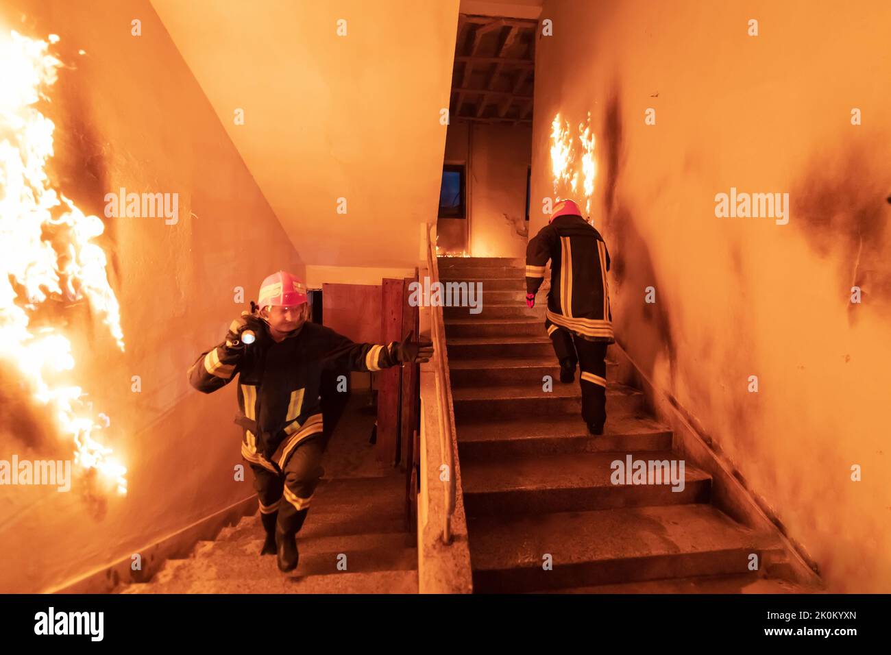 Brave Fireman going upstairs to save and rescue people in a Burning ...