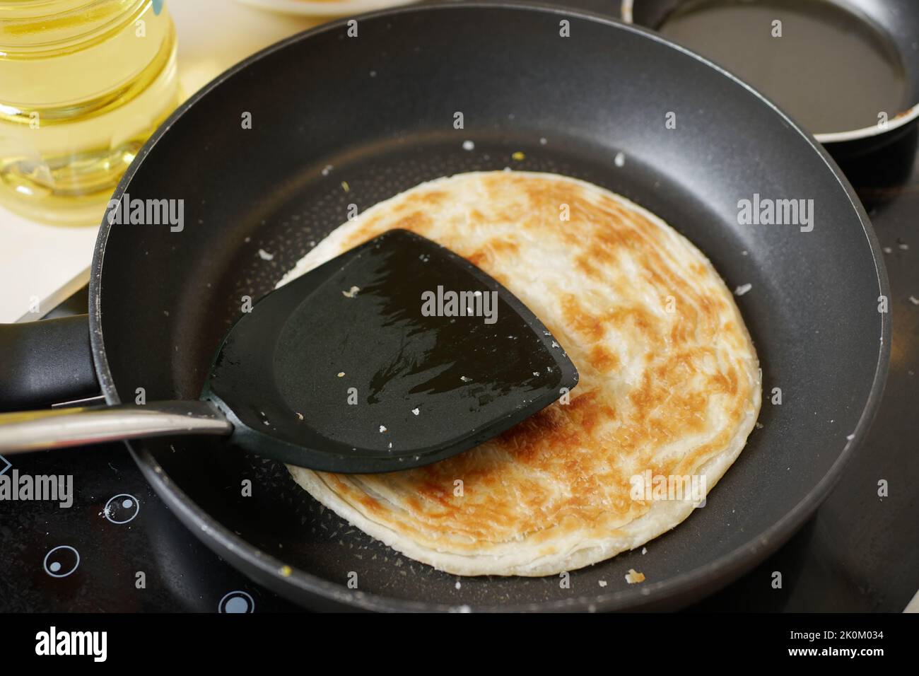 cooking roti chapati on a big cooking pan Stock Photo - Alamy