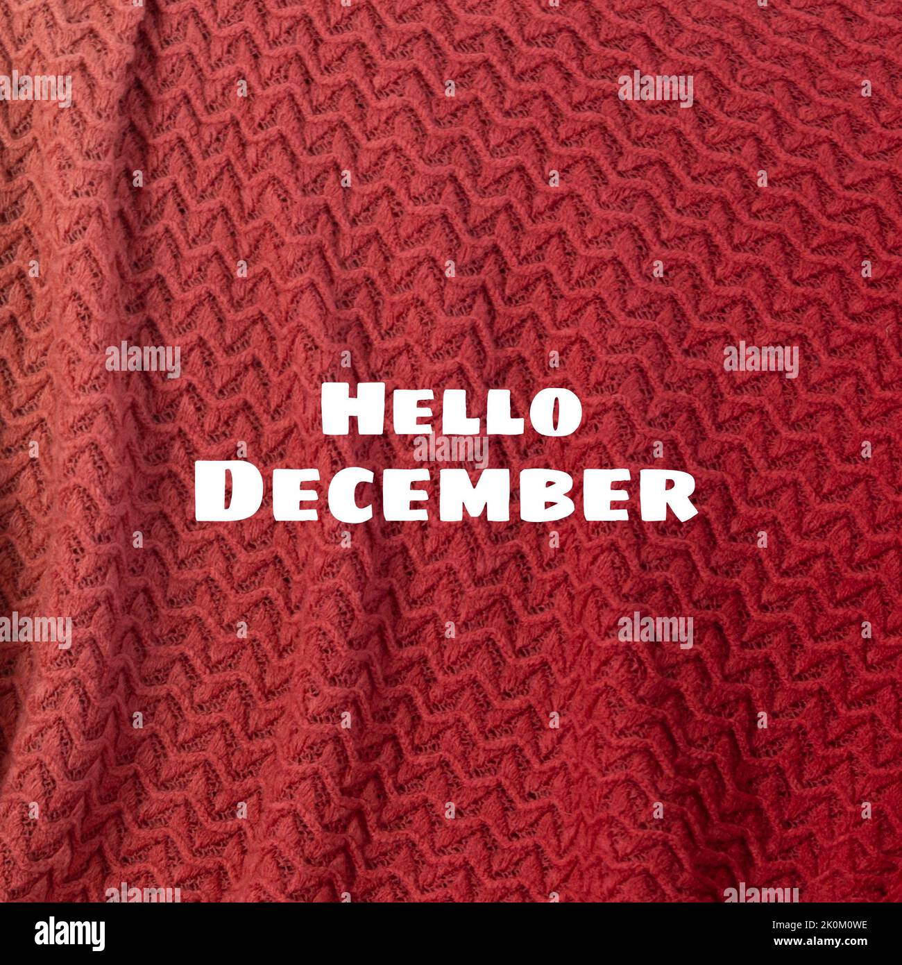 Composition of hello december text over red background Stock Photo - Alamy