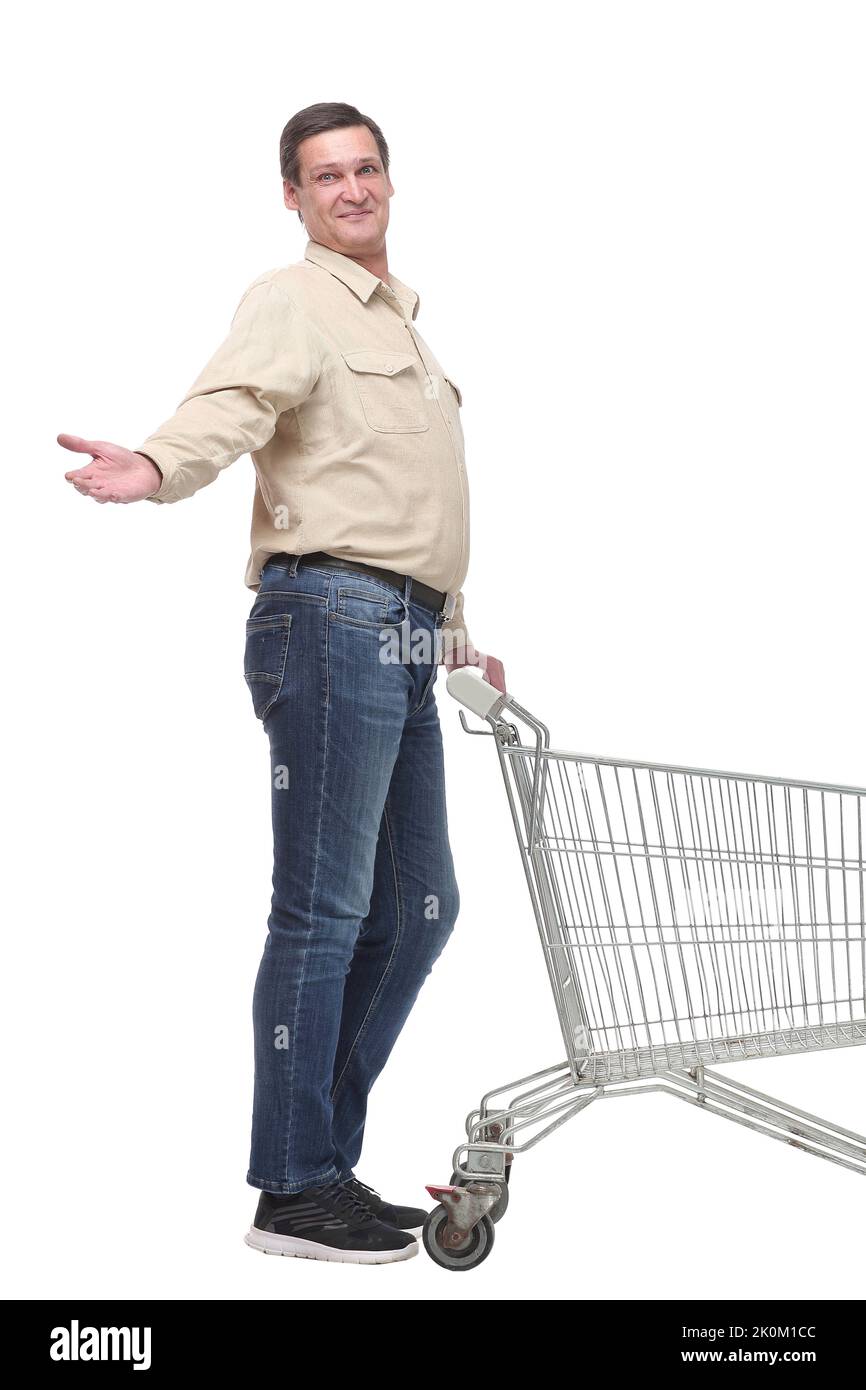 Side view of young man pushing an empty shopping cart Stock Photo - Alamy