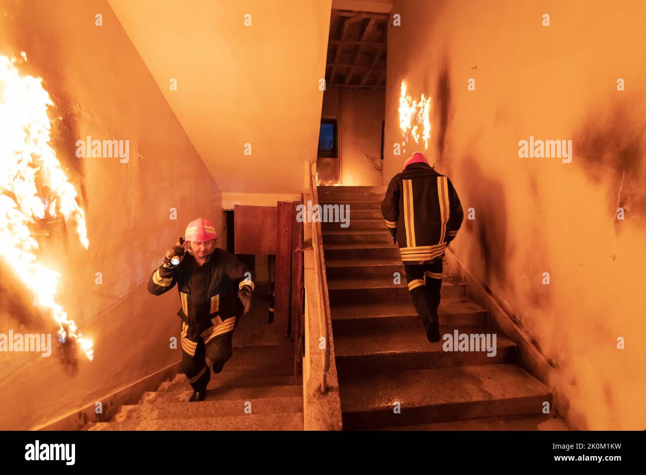 Brave Fireman going upstairs to save and rescue people in a Burning ...